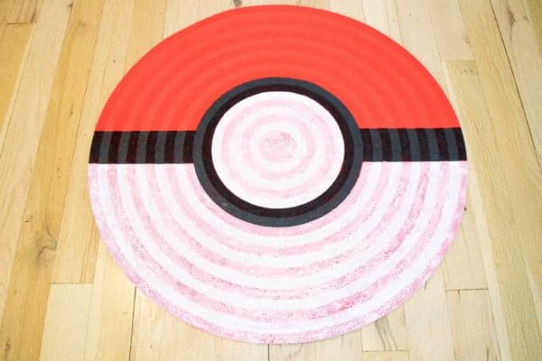 How to Paint a Rug [DIY Poké Ball Rug] - The Handyman's Daughter